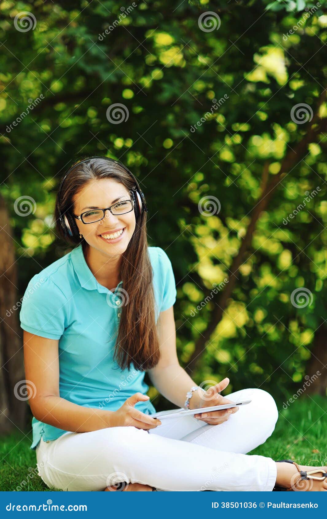 Young Woman Using Tablet Outdoor Sitting on Grass Stock Photo - Image ...