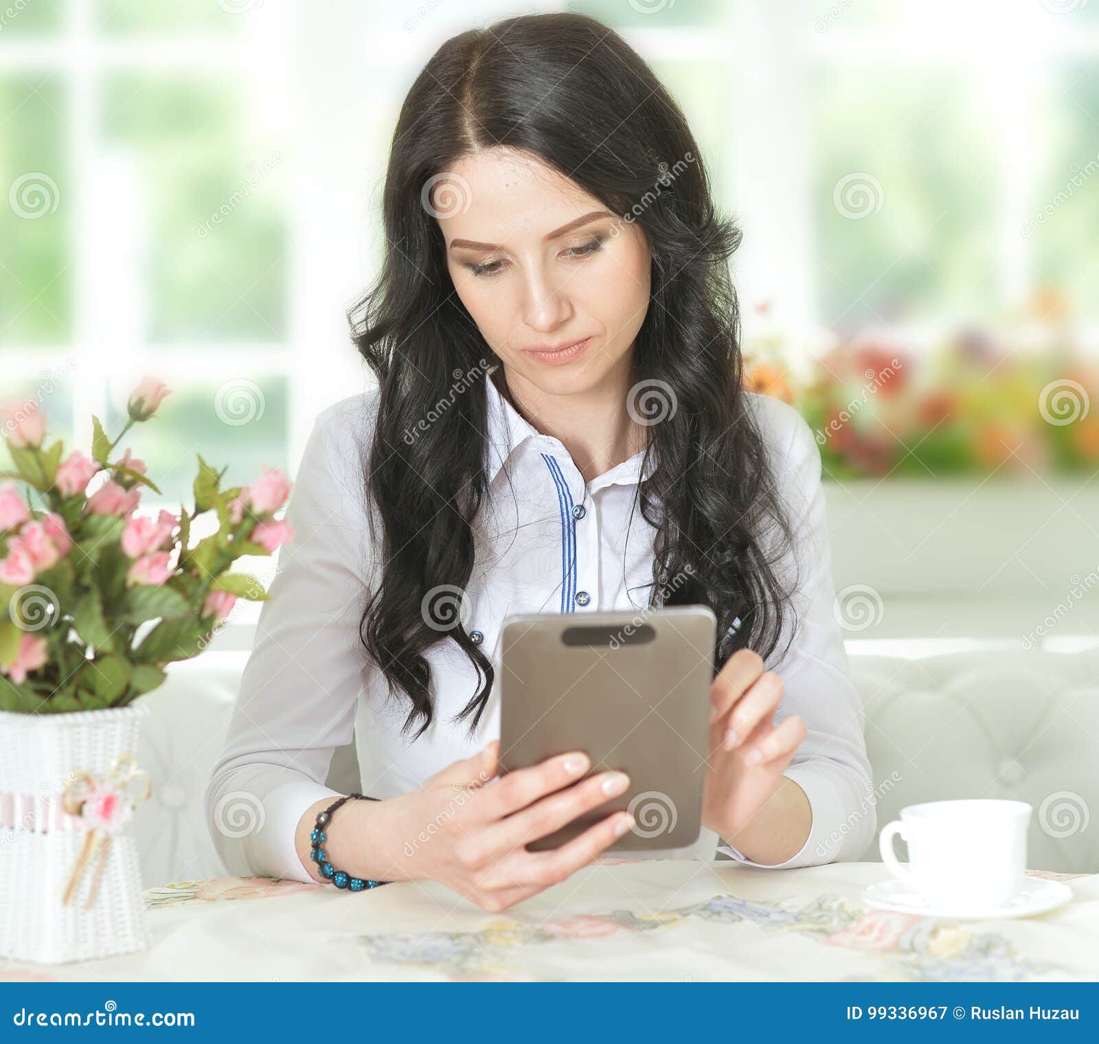 Young woman using tablet stock image. Image of race, life - 99336967