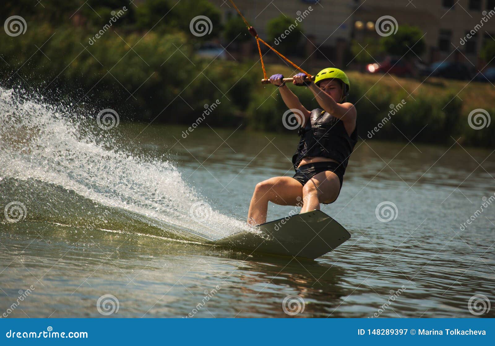 Young Woman on a Wakeboard stock image. Image of motorboat - 148289397