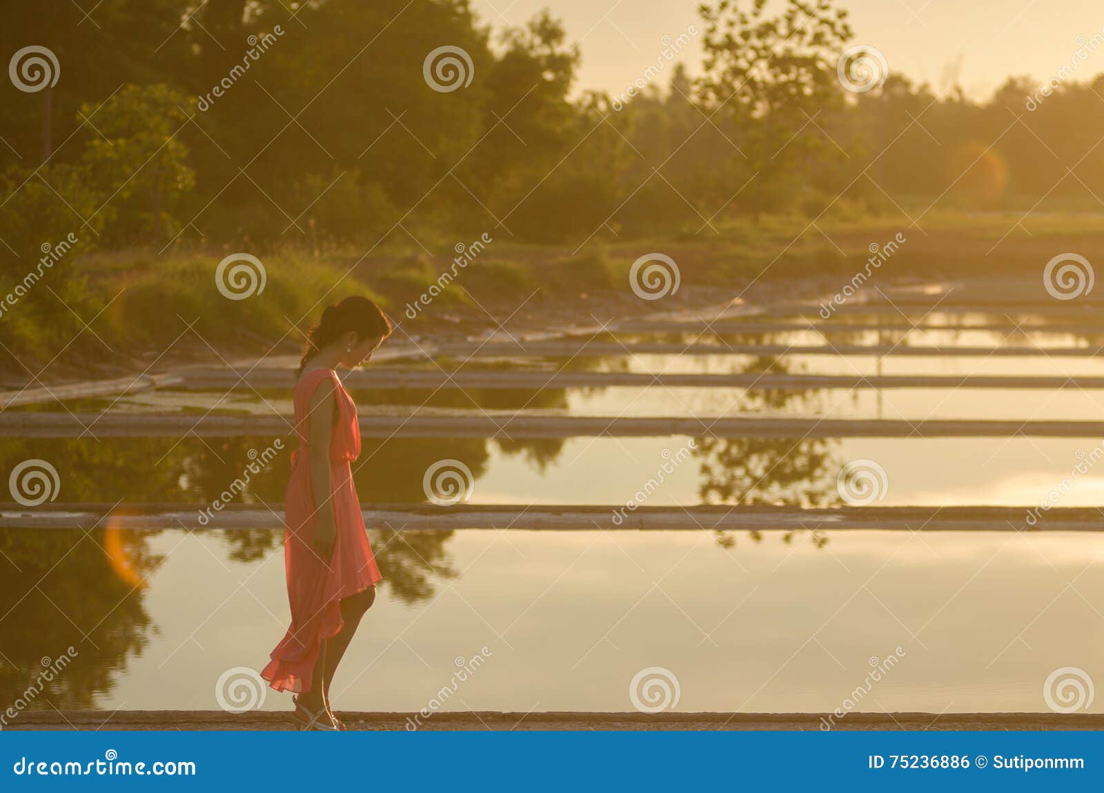 Young woman walking alone stock photo. Image of backpack - 75236886