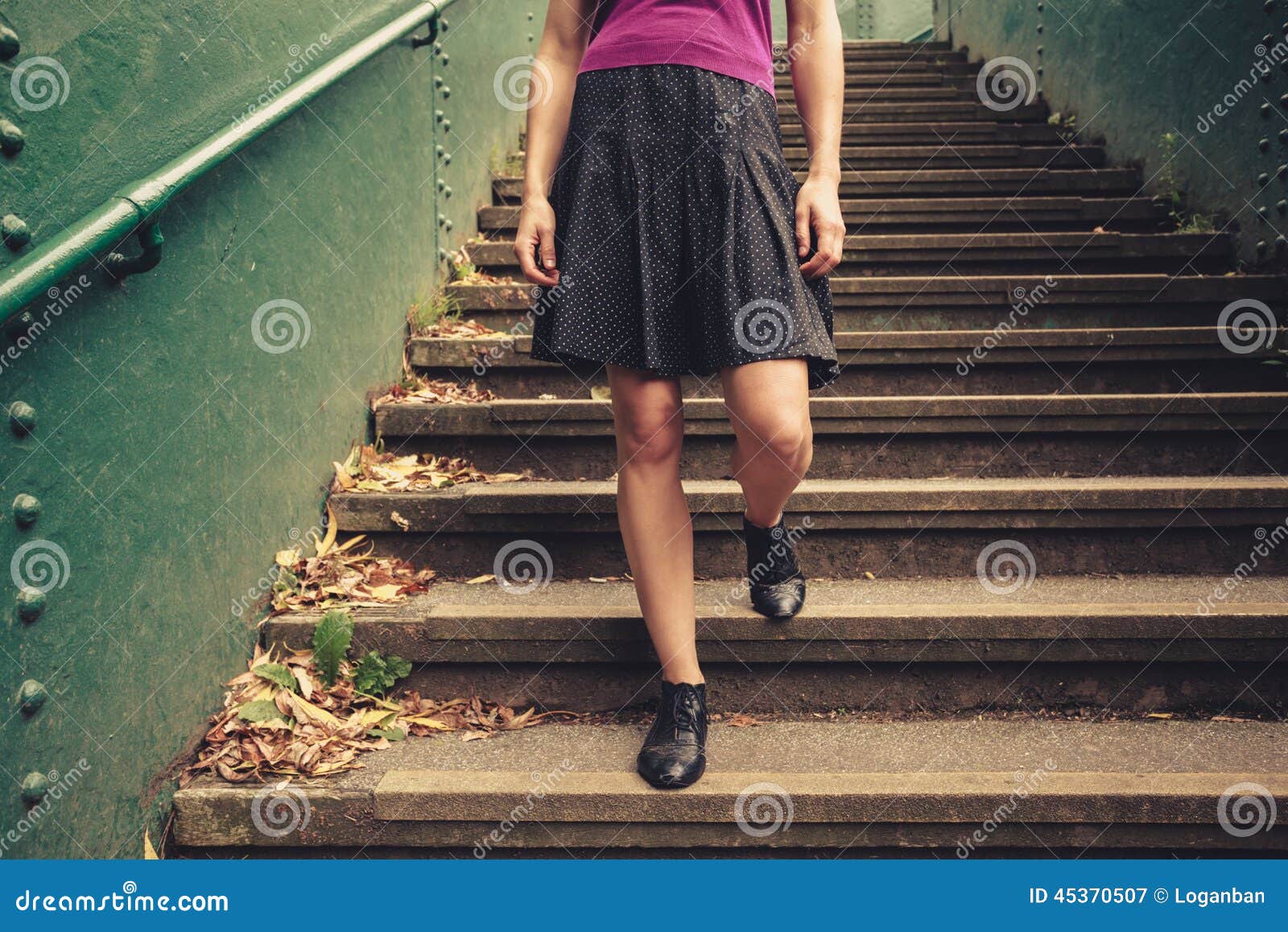 Young Woman Walking Down Stairs Stock Image - Image of clothing ...