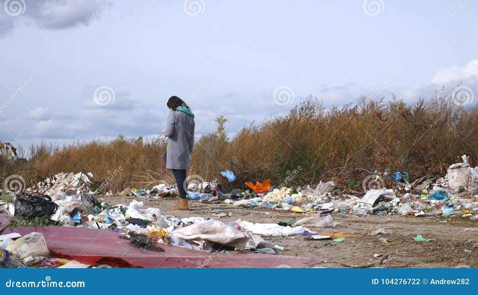 Young Woman Walking through a Garbage Dump Editorial Photography ...