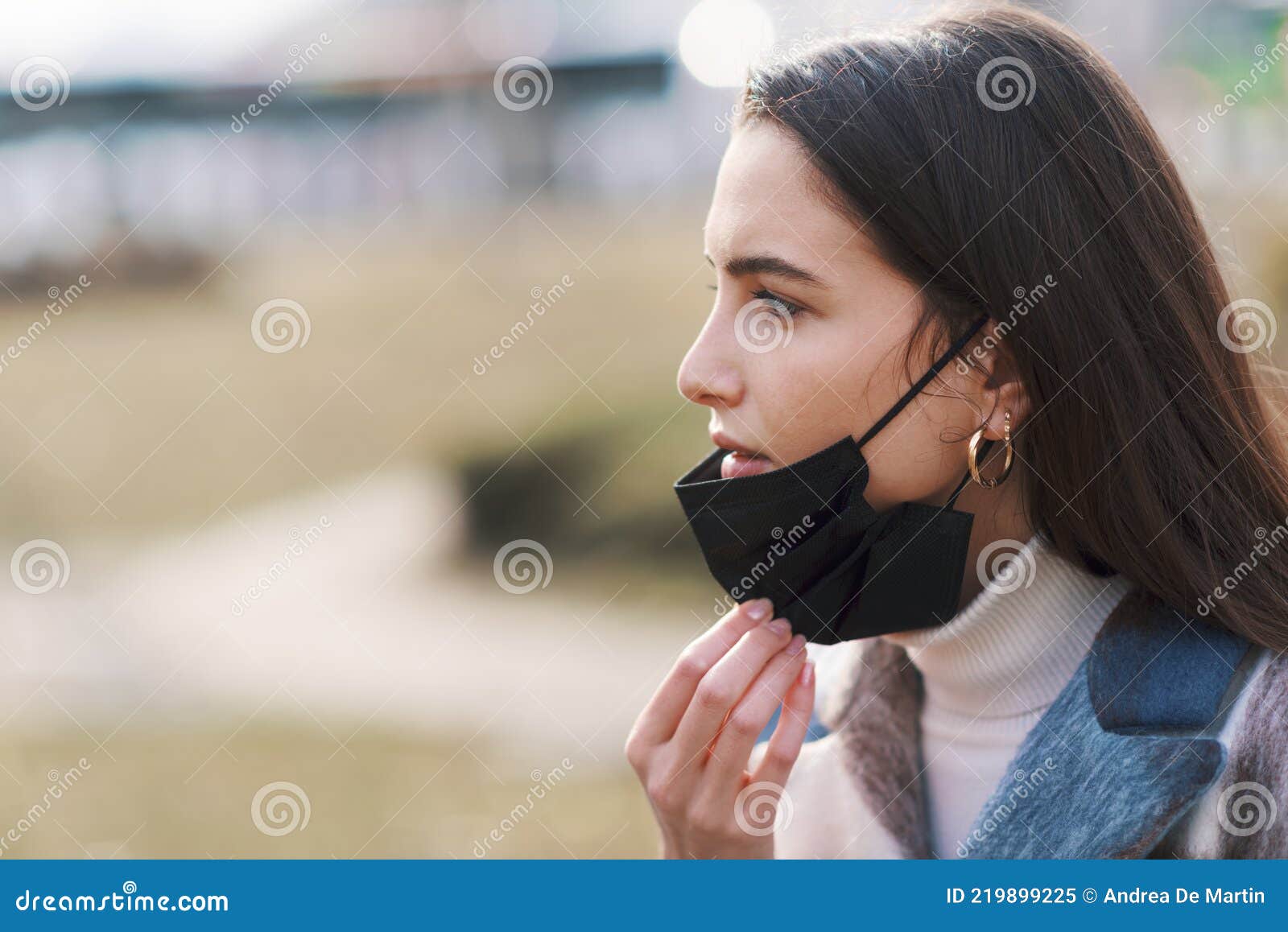 Young Woman Pulling Her Face Mask Down Outdoors Stock Image - Image of ...