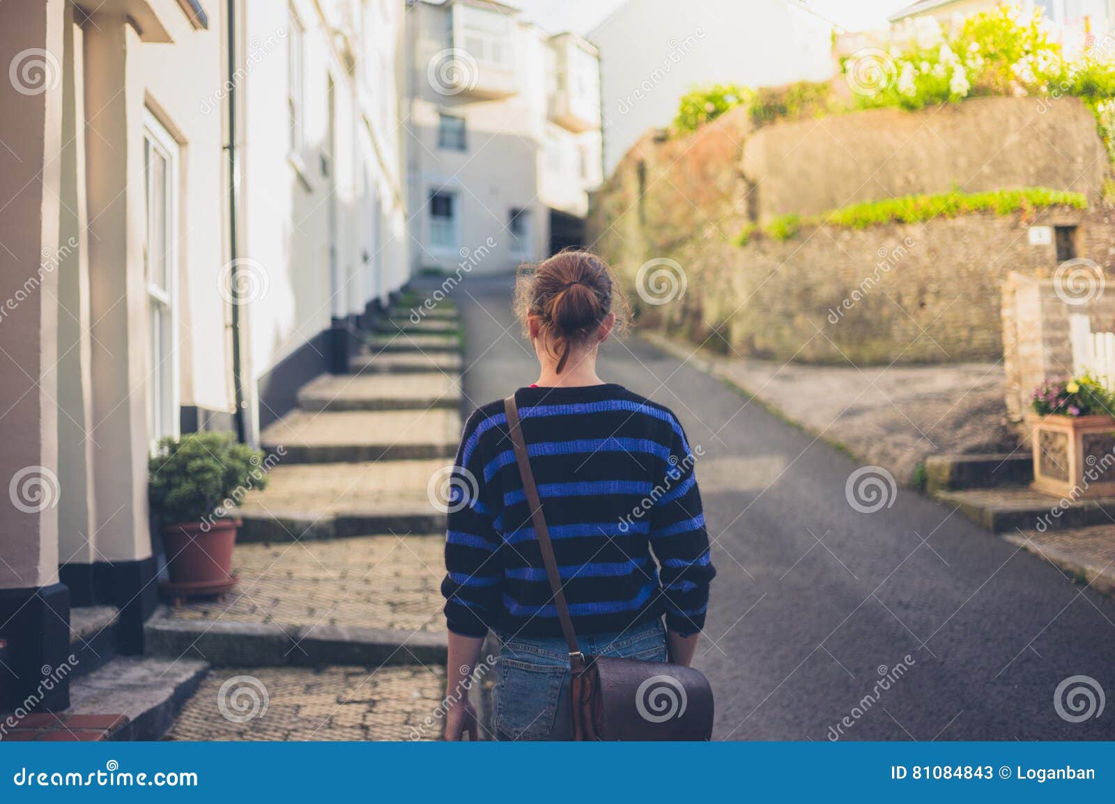 Young Woman Walking in Small Town Stock Image - Image of travel ...