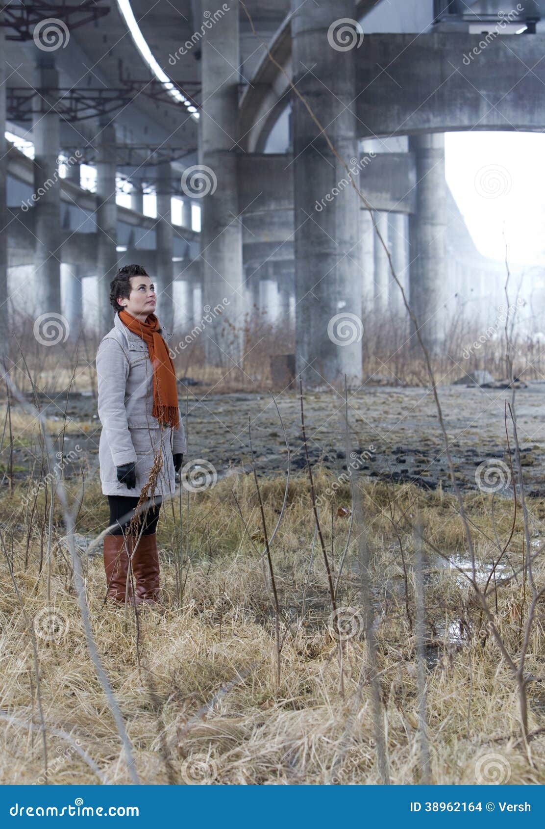Young Woman Walking Under the Bridge Stock Photo - Image of fashion ...