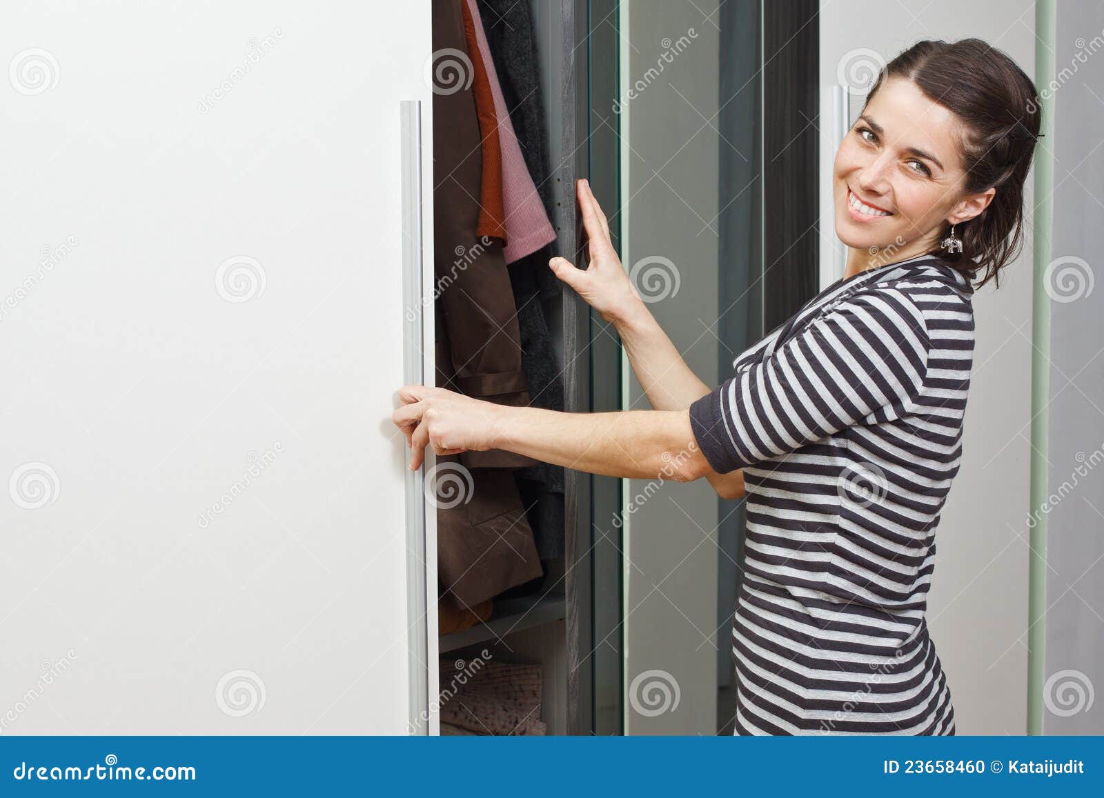 Young woman at wardrobe stock photo. Image of person - 23658460