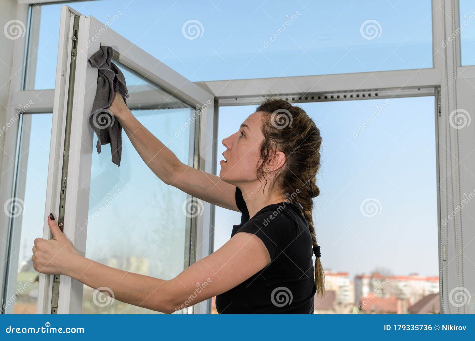 Young Woman Washes a Window with a Rag Stock Photo - Image of ...