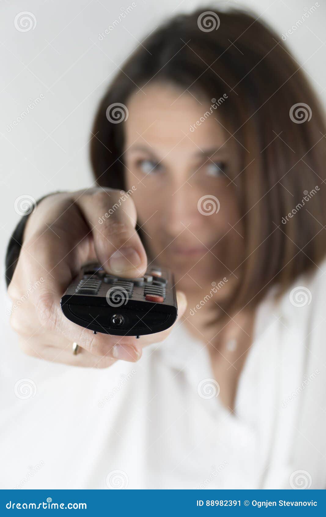 Young woman watching TV stock image. Image of cute, adult - 88982391