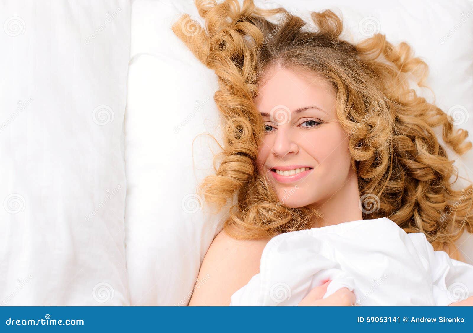 Young Woman With Wavy Hair Lying On Bed Stock Image Image Of Hair