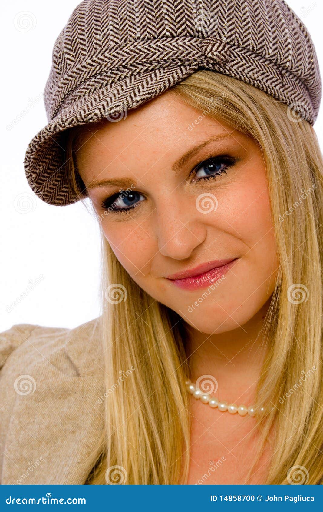 Young Woman Wearing Mod Cap Smiles at Camera Stock Photo - Image of ...