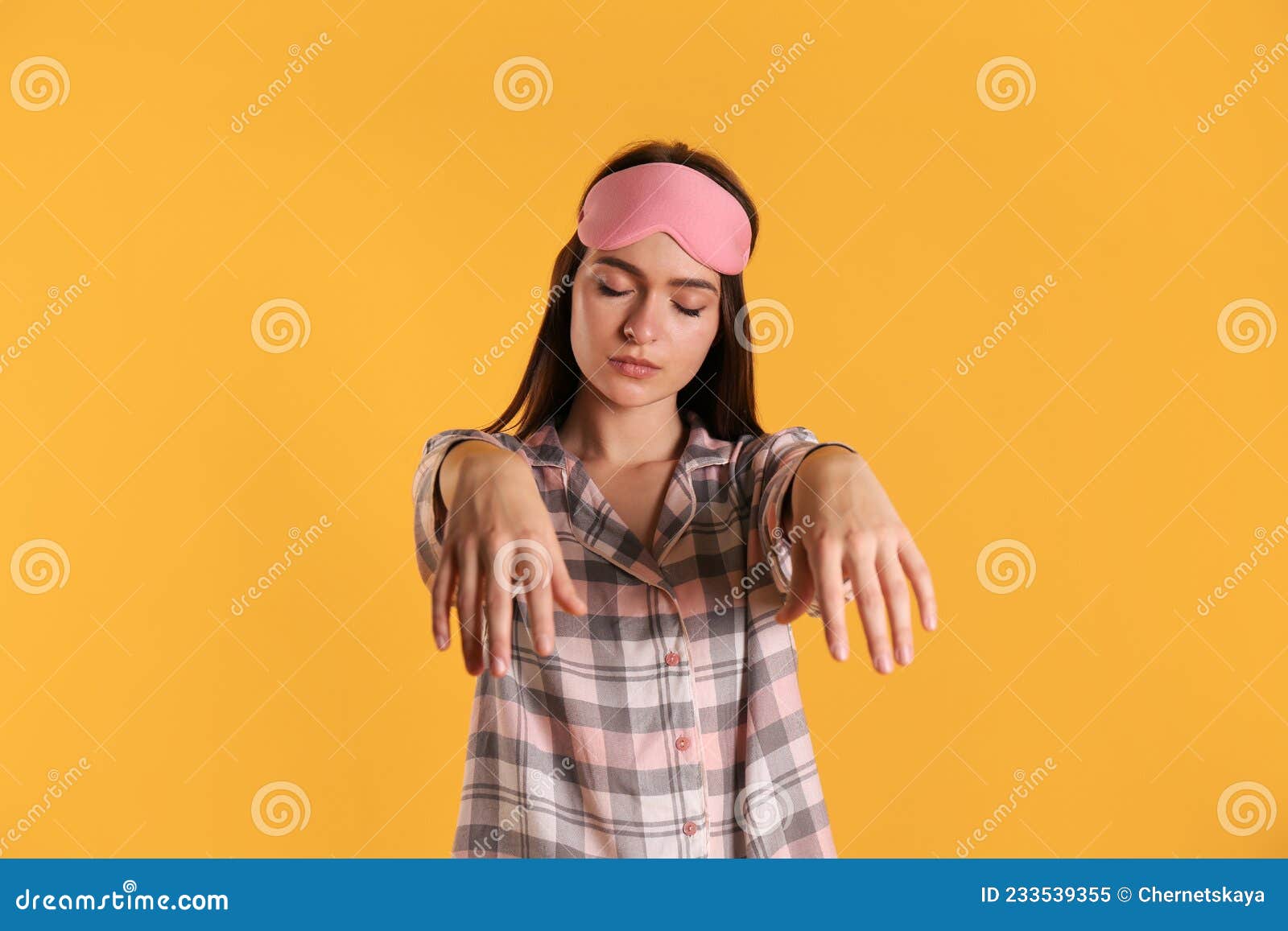 Young Woman Wearing Pajamas and Mask in Sleepwalking State on Yellow ... Young Woman Wearing Pajamas and Mask in Sleepwalking State on Yellow ...