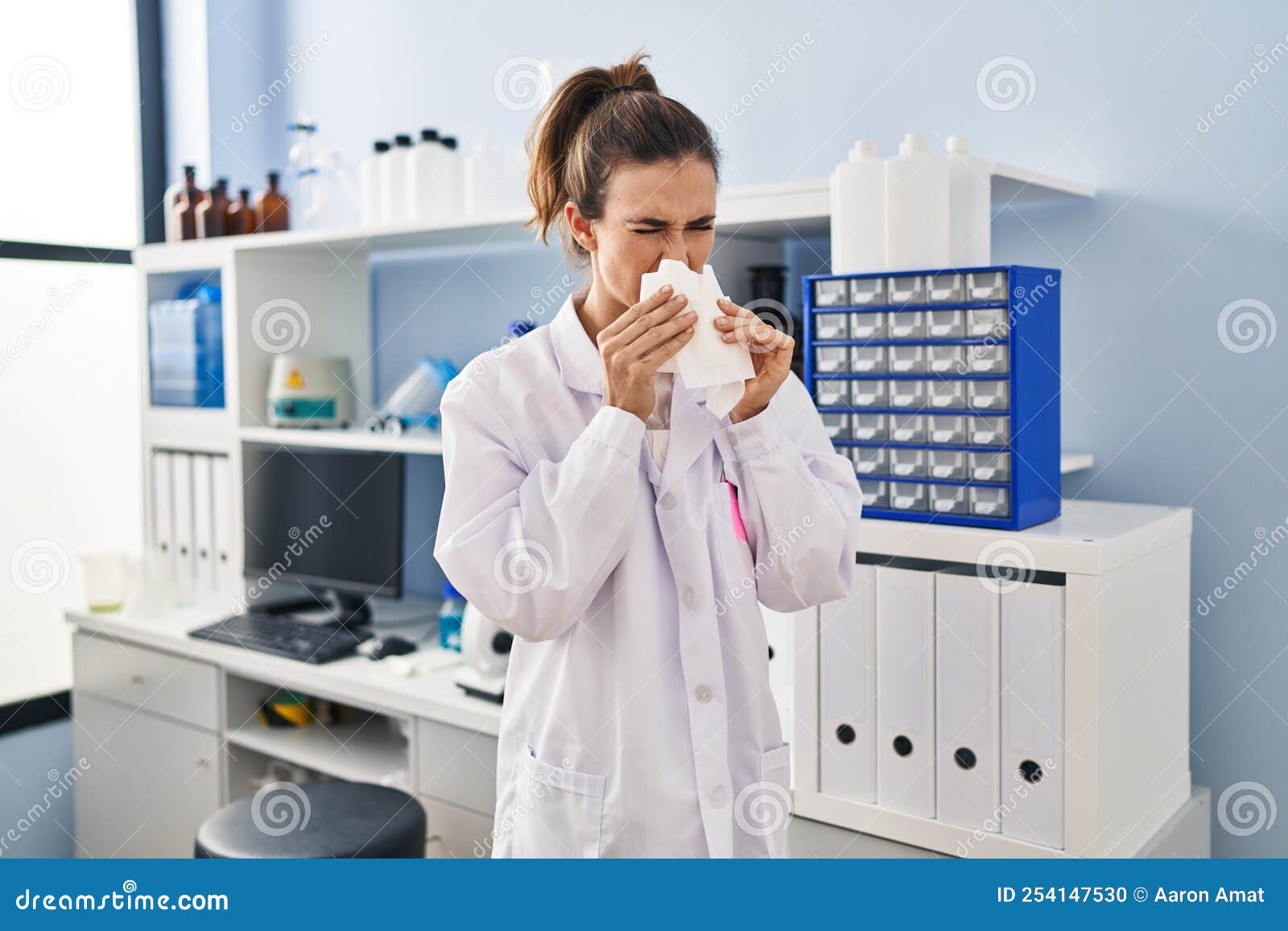 Young Woman Wearing Scientist Uniform Using Napkin at Laboratory Stock ...