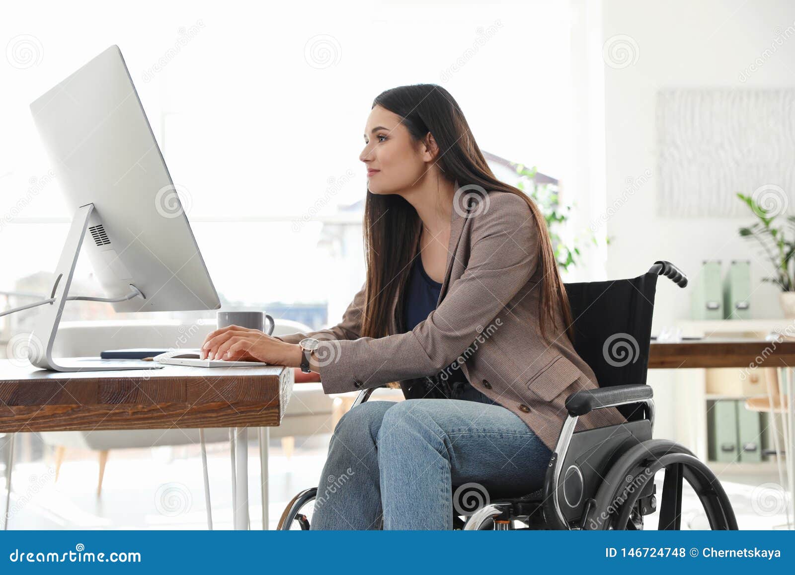 Young Woman in Wheelchair Using Computer Stock Photo - Image of happy ...
