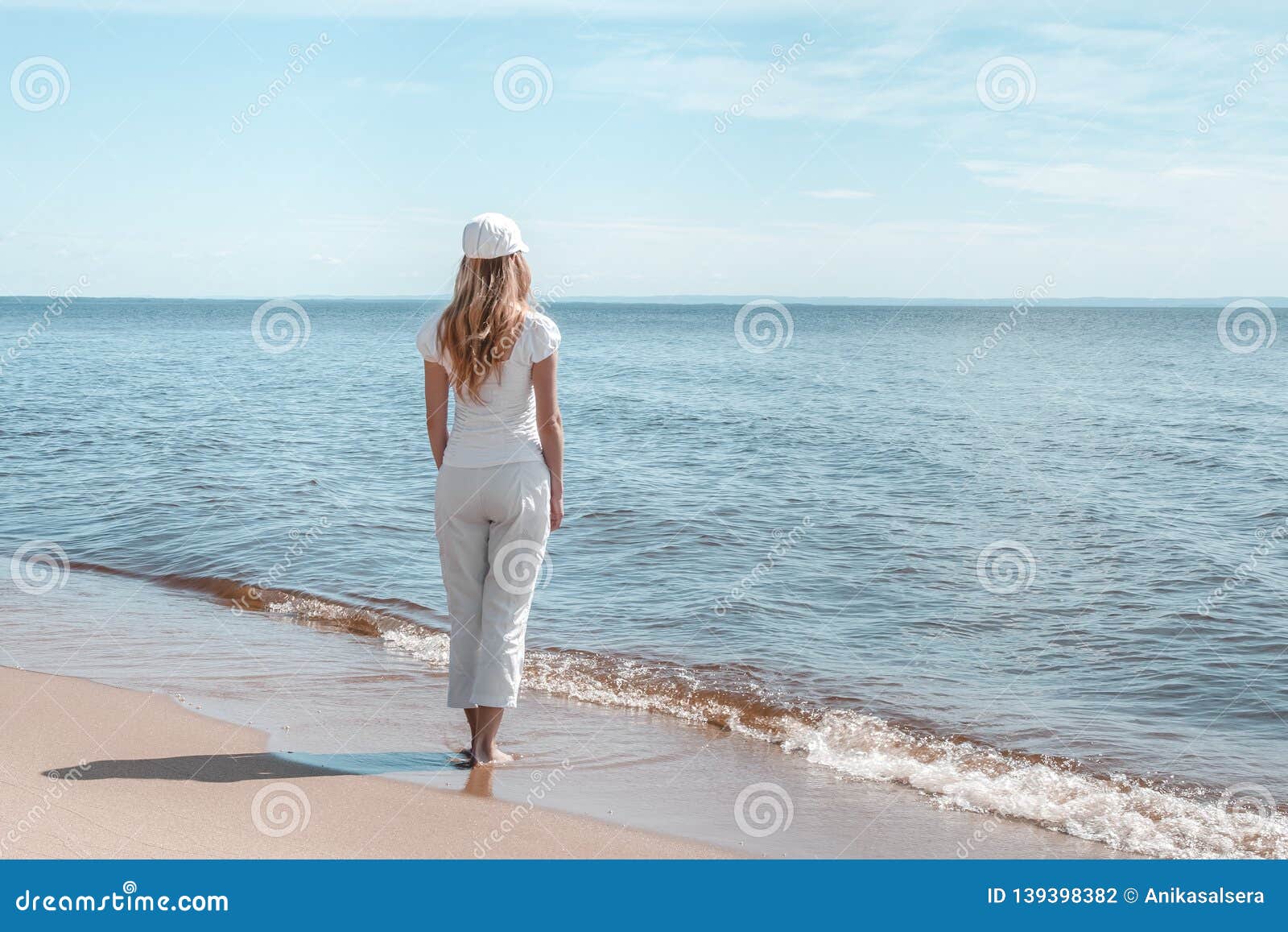 Young Woman in White Looking at Water Stock Photo - Image of long, back ...