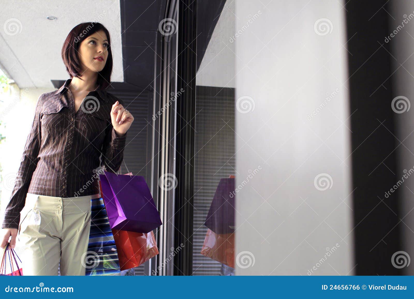Young Woman Window Shopping Stock Photo - Image of looking, interior ...