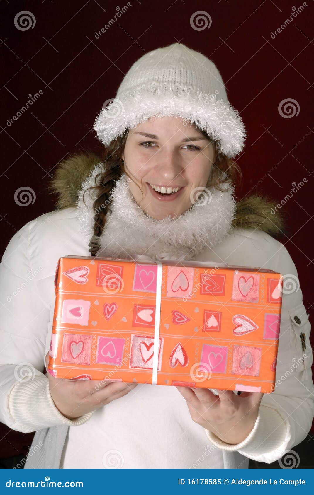 Young Woman in Winter Clothing with a Gift Stock Image - Image of happy ...
