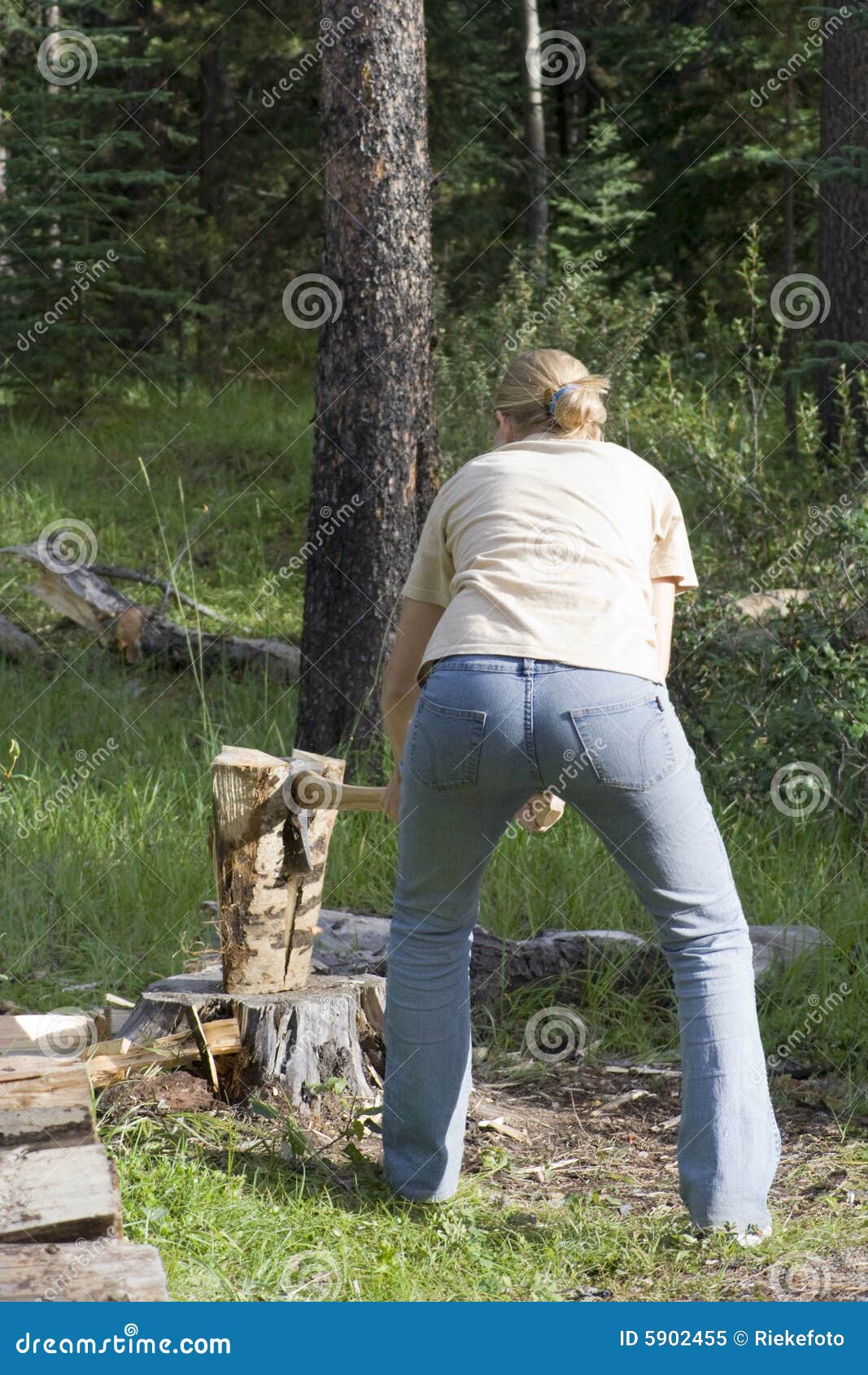 Young woman wood-chopping stock image. Image of portrait - 5902455