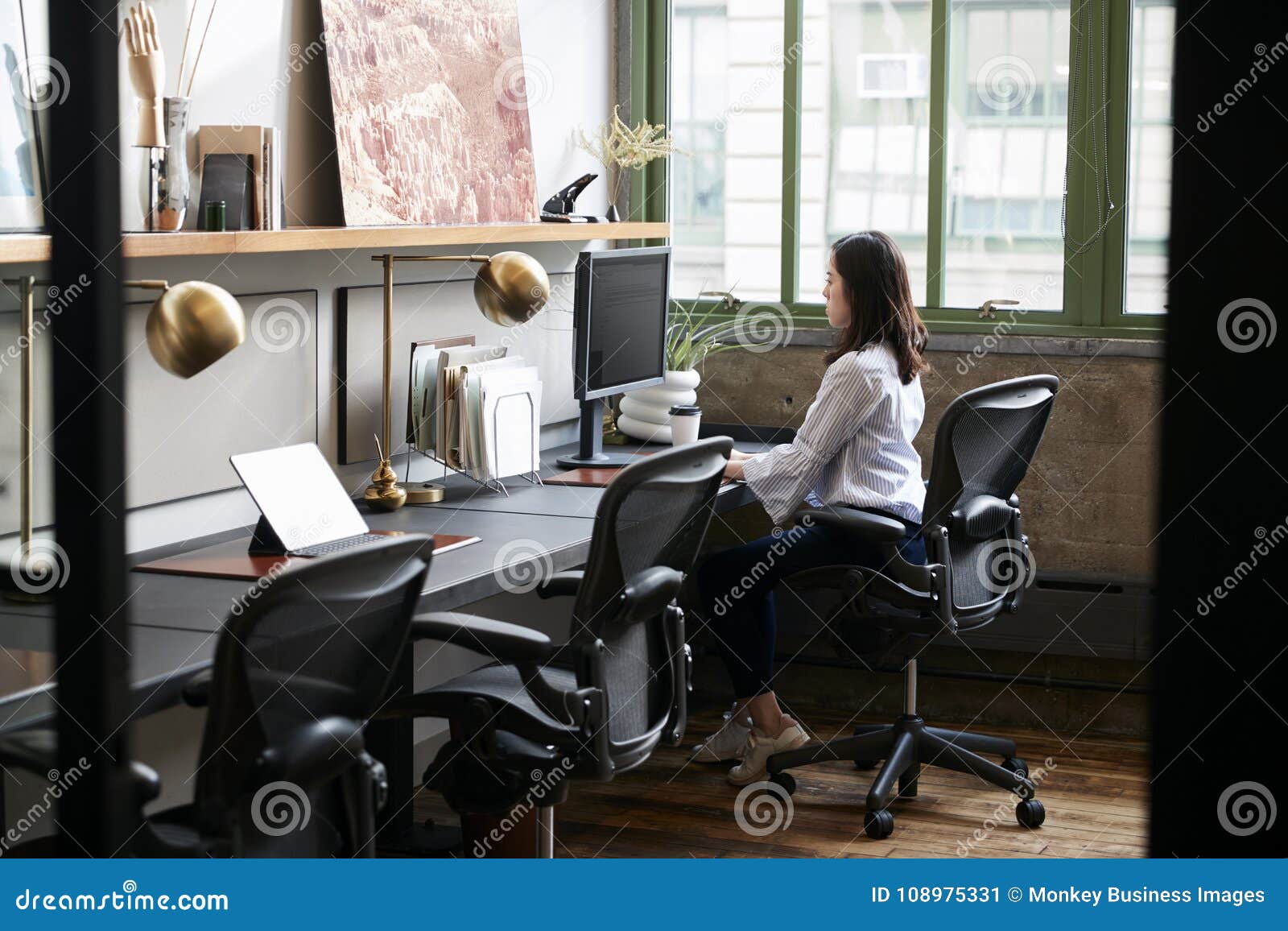 Young Woman Working Alone in a Compact Office Stock Image - Image of ...