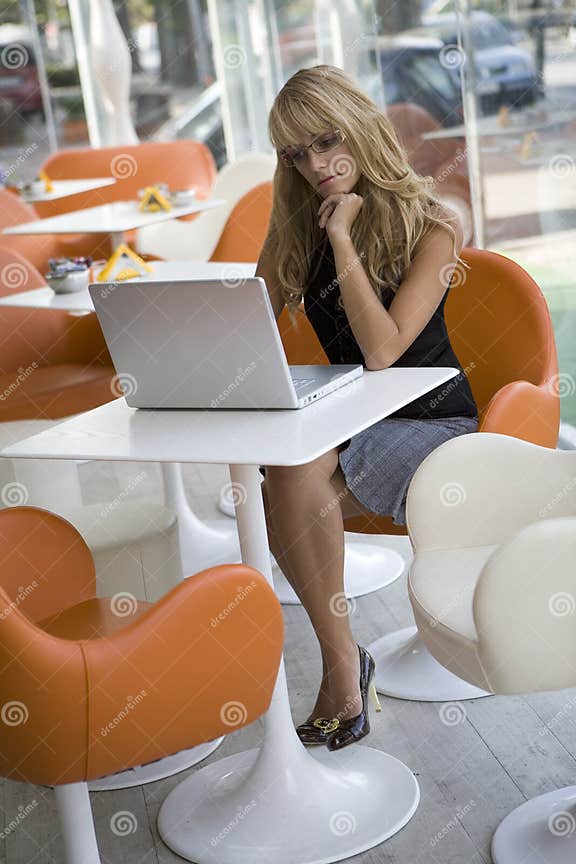 Young Woman Working with Computer in a Cafe Stock Image - Image of ...