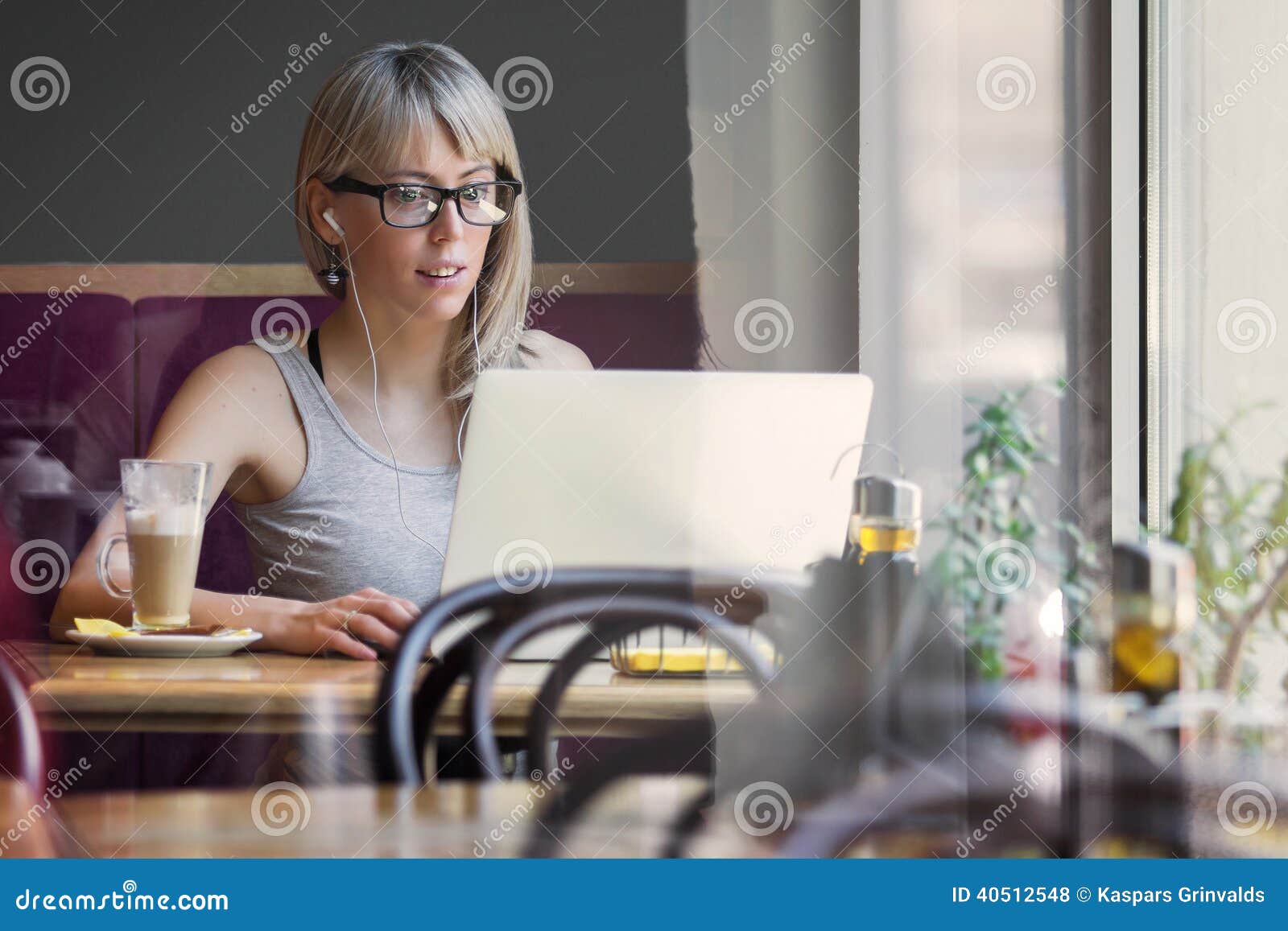 Young Woman Working with Computer in Cafe Stock Photo - Image of ...