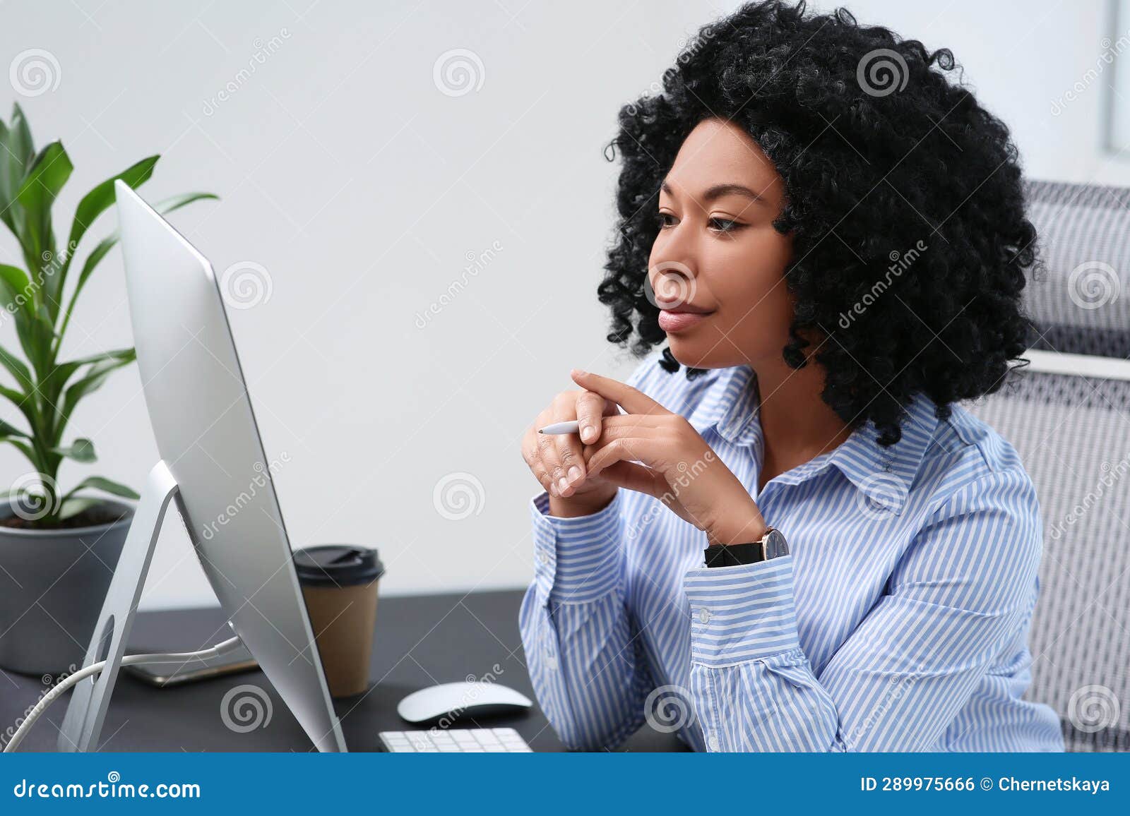 Young Woman Working on Computer at Table in Office Stock Photo - Image ...