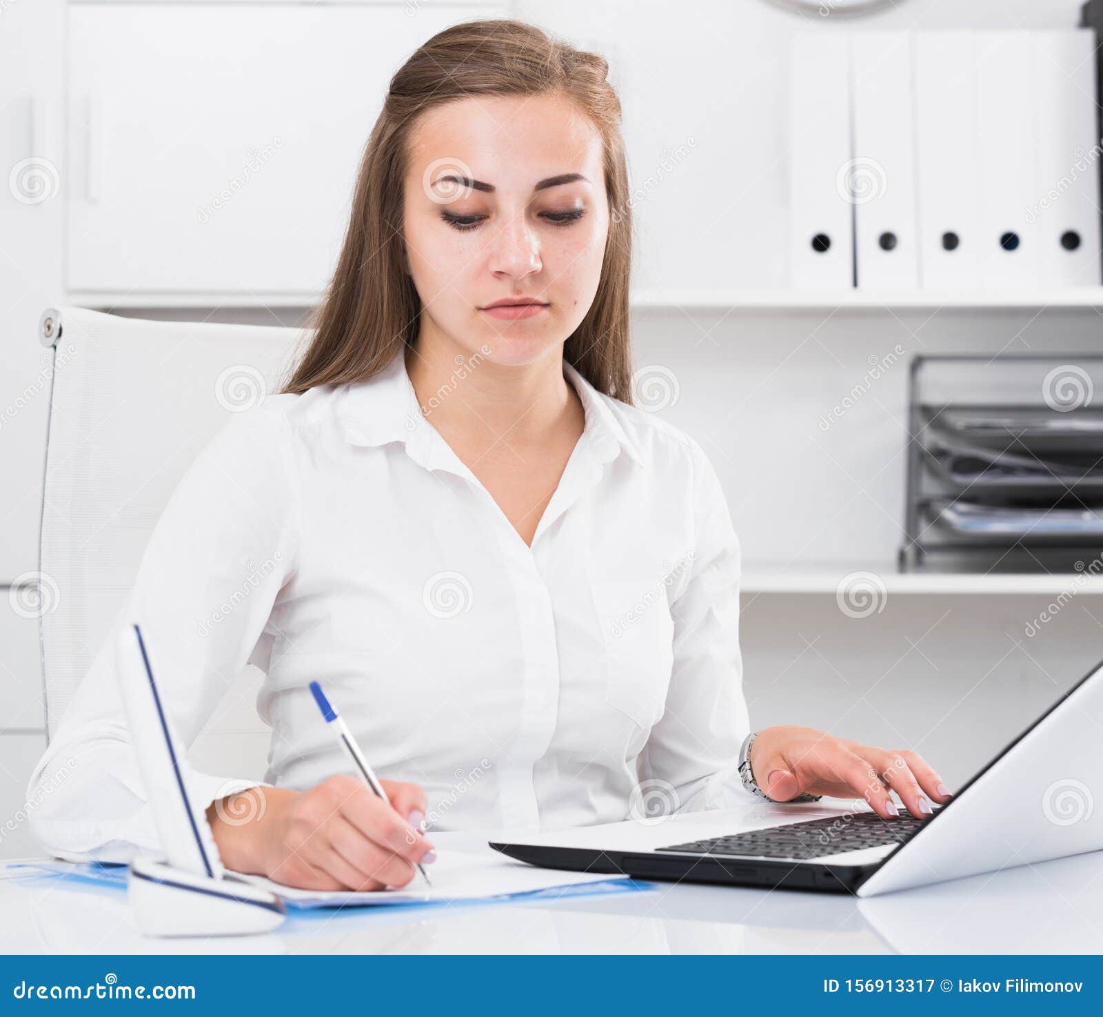 Young Woman is Working with Documents and Laptop Stock Image - Image of ...