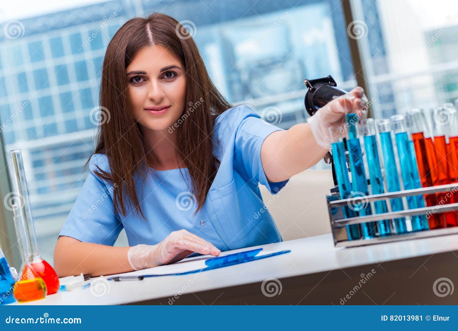 The Young Woman Working in the Laboratory Stock Image - Image of fluid ...