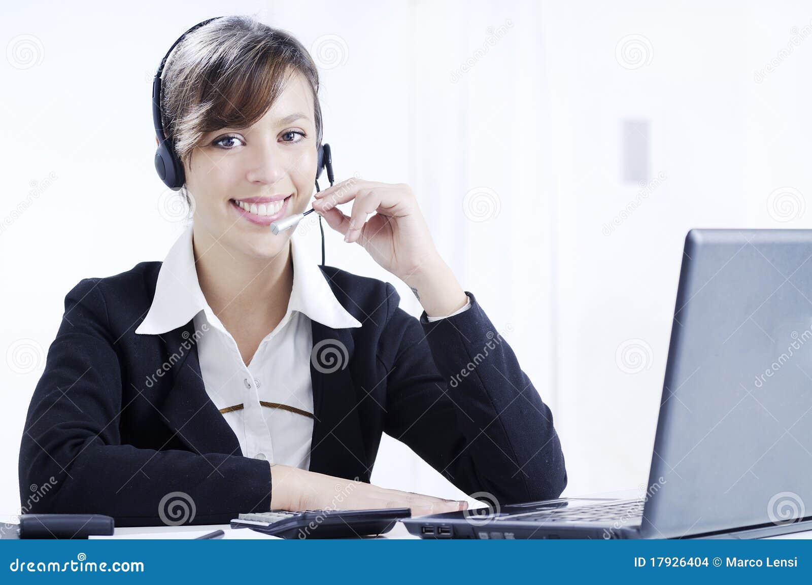 Young Woman Working and Smiling Stock Photo - Image of headphones ...