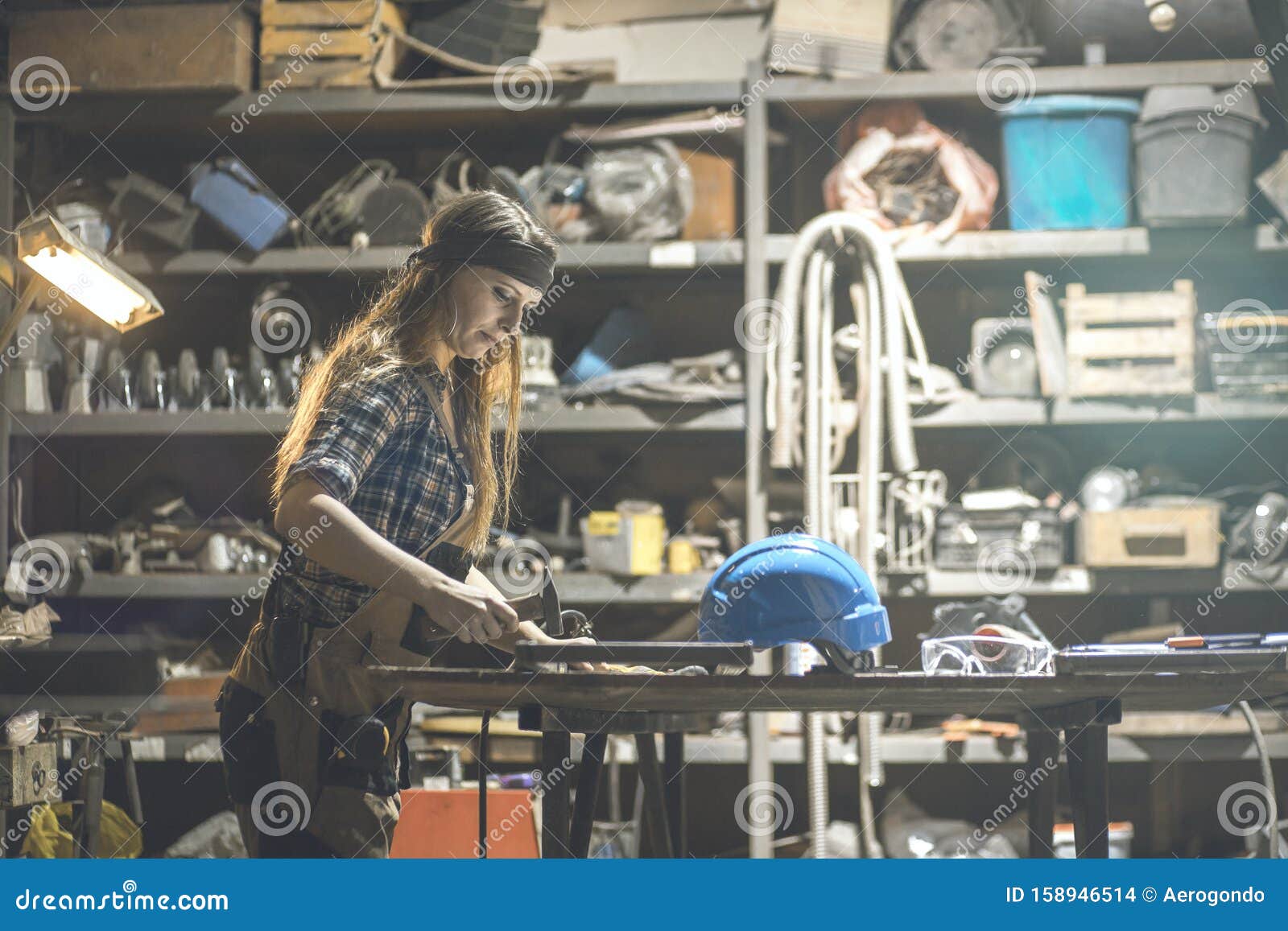 Young Woman Working in a Workshop Stock Photo - Image of hammer ...