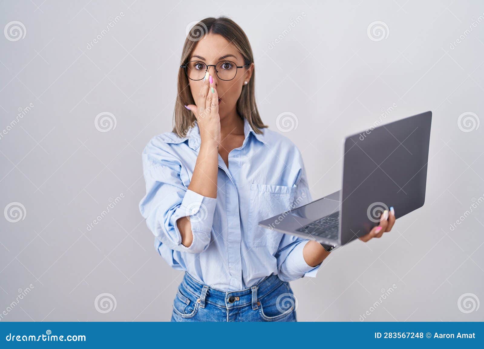 Young Woman Working Using Computer Laptop Afraid and Shocked, Surprise ...