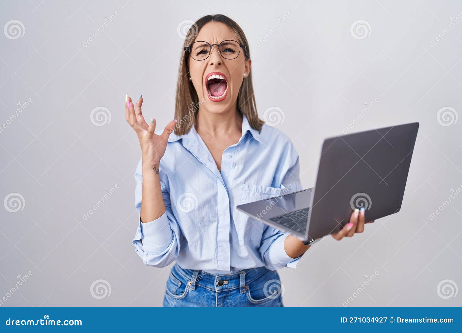 Young Woman Working Using Computer Laptop Crazy and Mad Shouting and ...