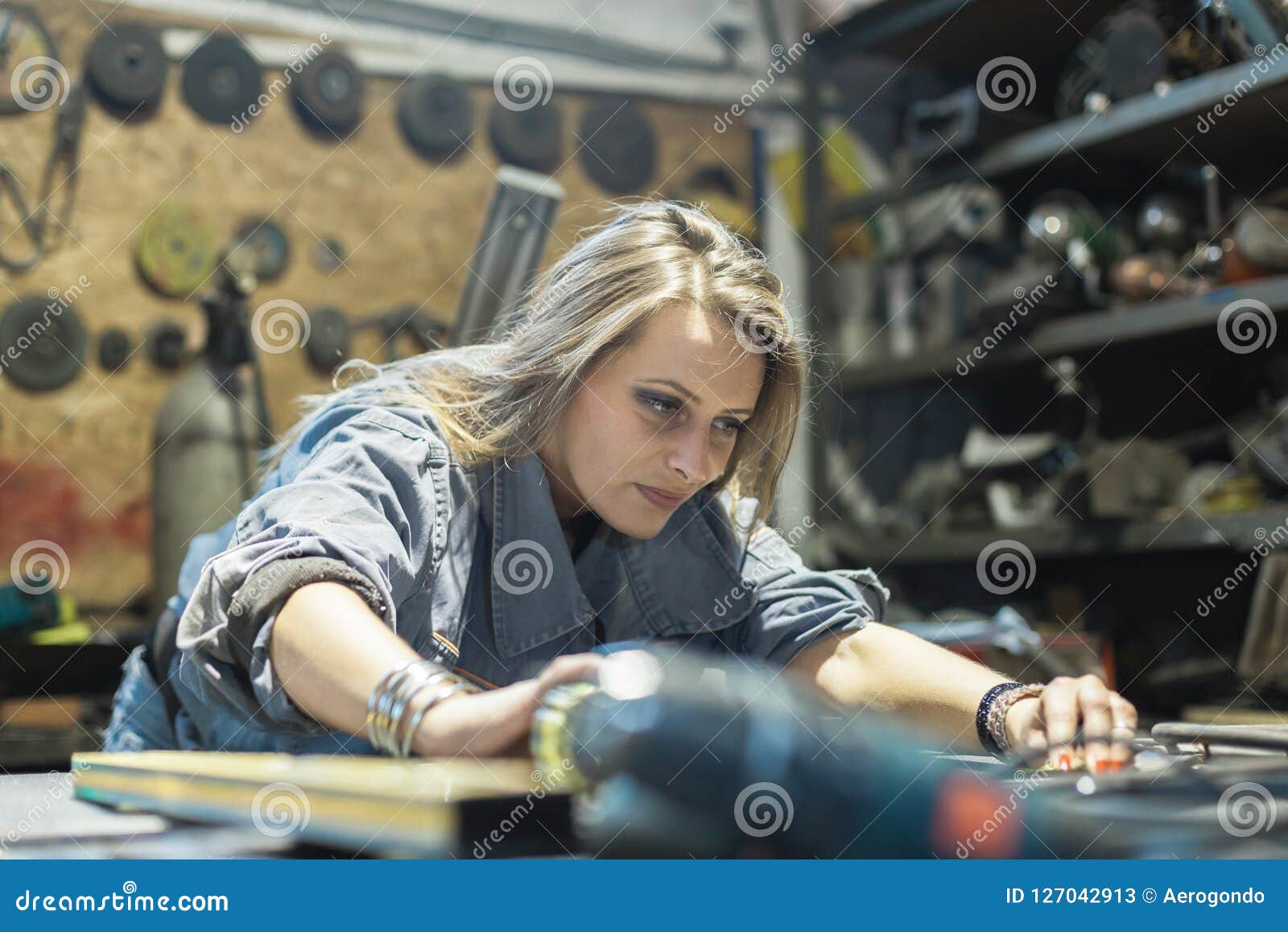 Young Woman Working in a Workshop Stock Image - Image of adult, person ...