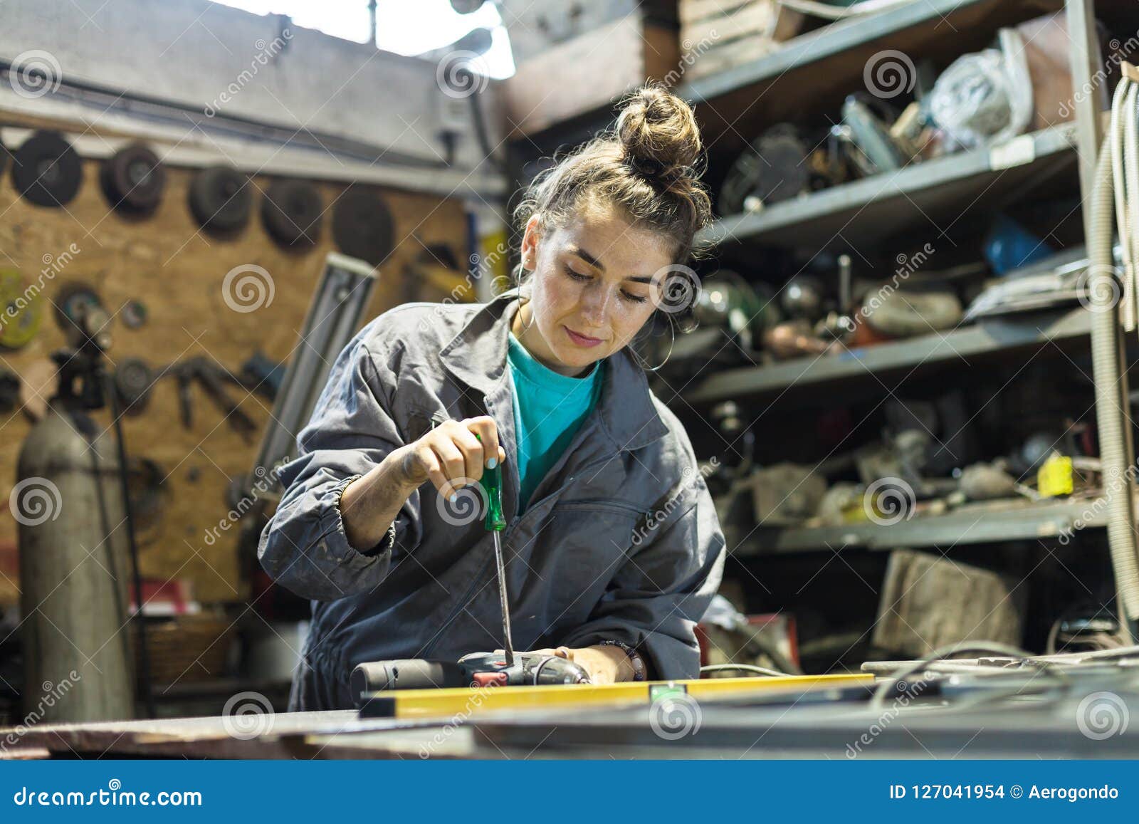 Young Woman Fixing Tool at Work Stock Photo - Image of occupation ...