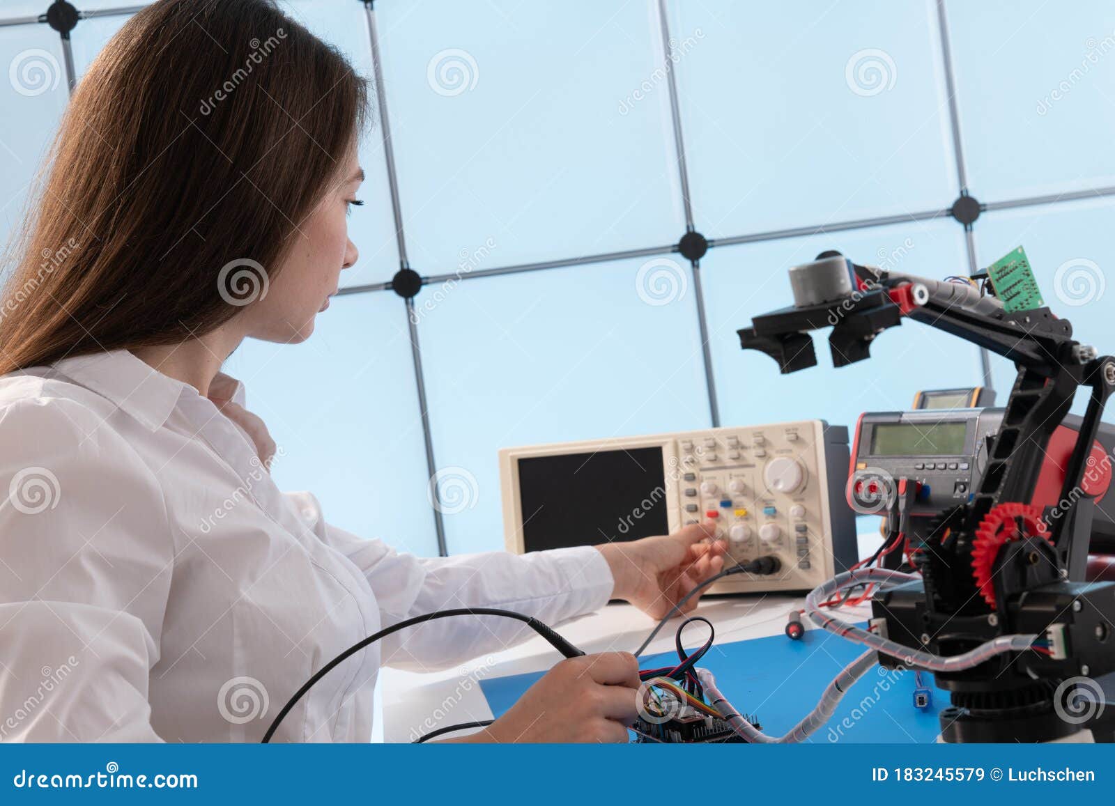 A Young Woman Writes an Algorithm for the Robot Arm. Science Research ...