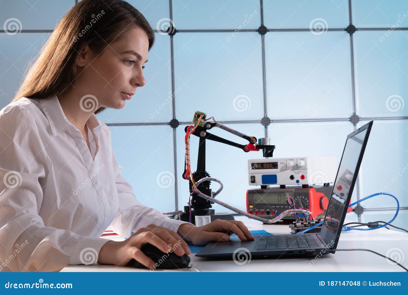 A Young Woman Writes an Algorithm for the Robot Arm. Science Research ...
