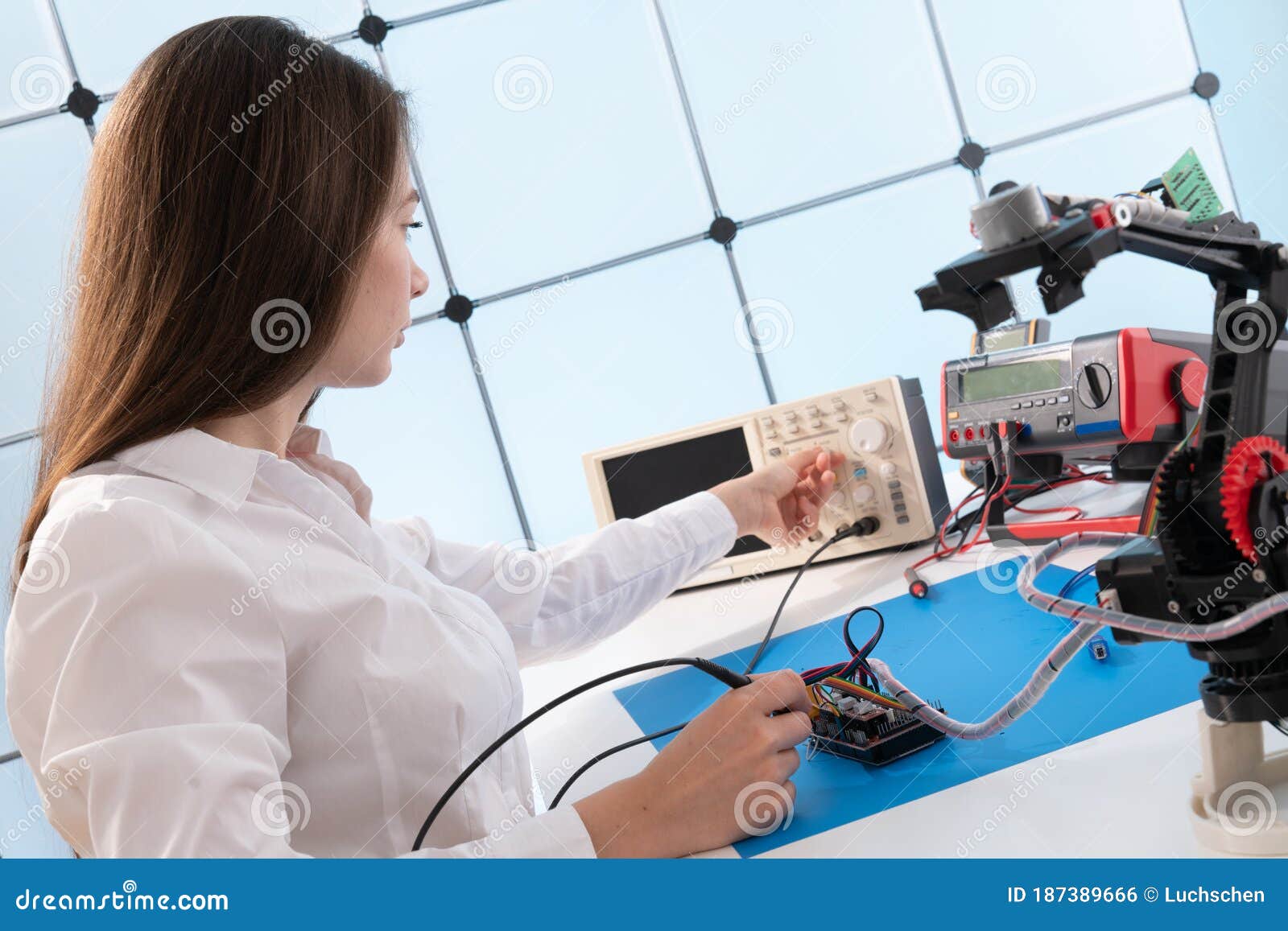 A Young Woman Writes an Algorithm for the Robot Arm. Science Research ...