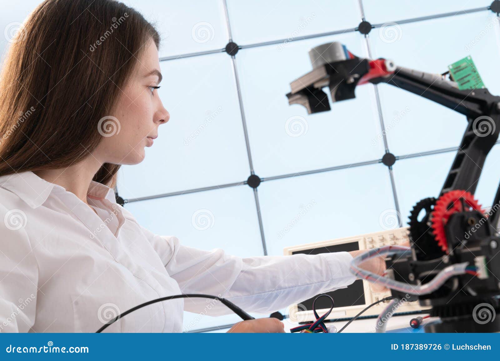 A Young Woman Writes an Algorithm for the Robot Arm. Science Research ...