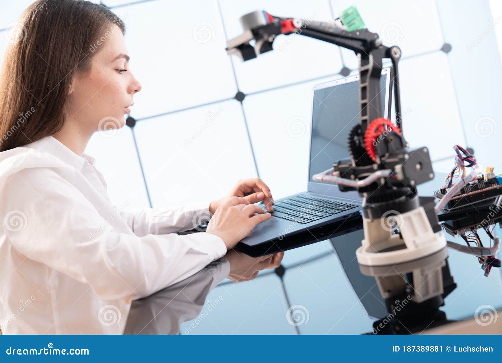 A Young Woman Writes an Algorithm for the Robot Arm. Science Research ...