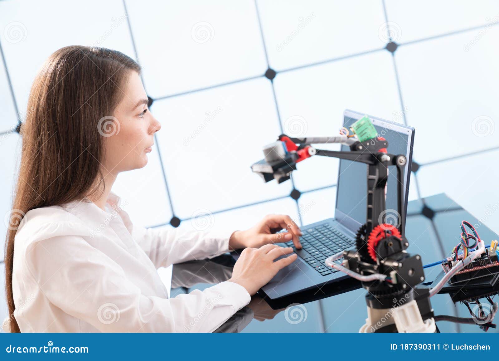 A Young Woman Writes an Algorithm for the Robot Arm. Science Research ...
