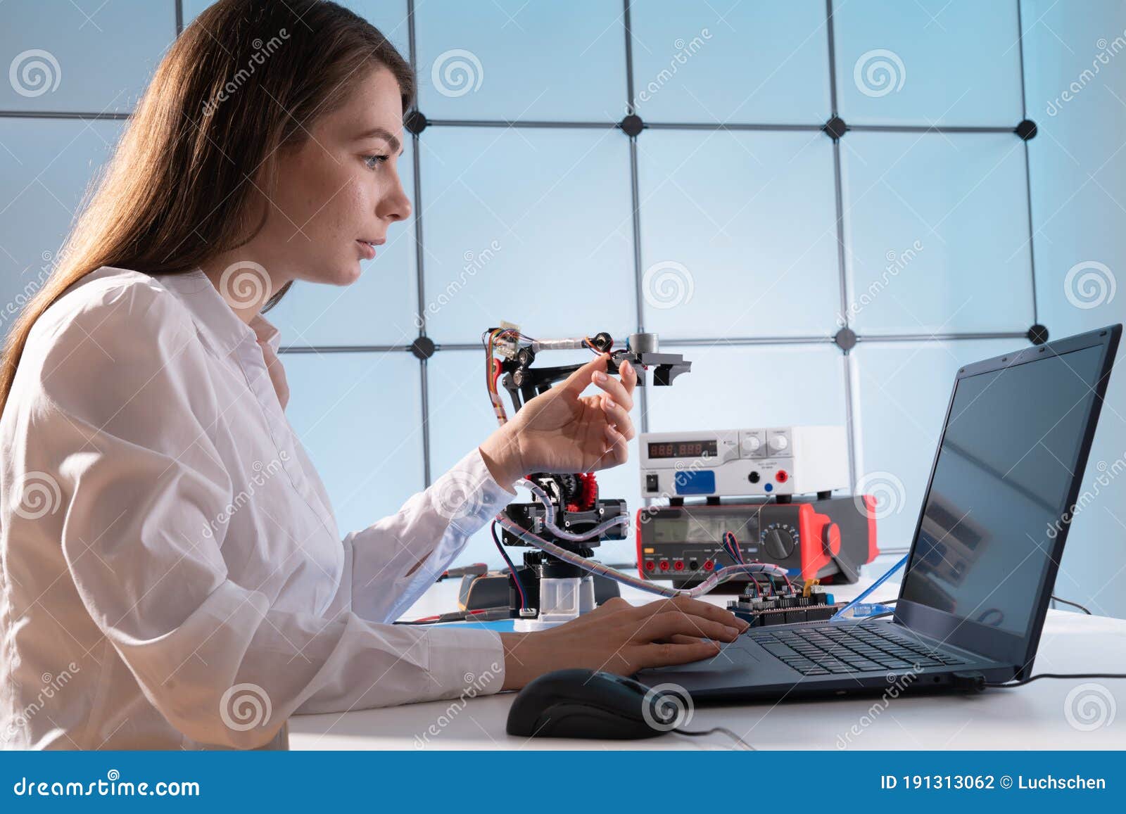 A Young Woman Writes an Algorithm for the Robot Arm. Science Research ...