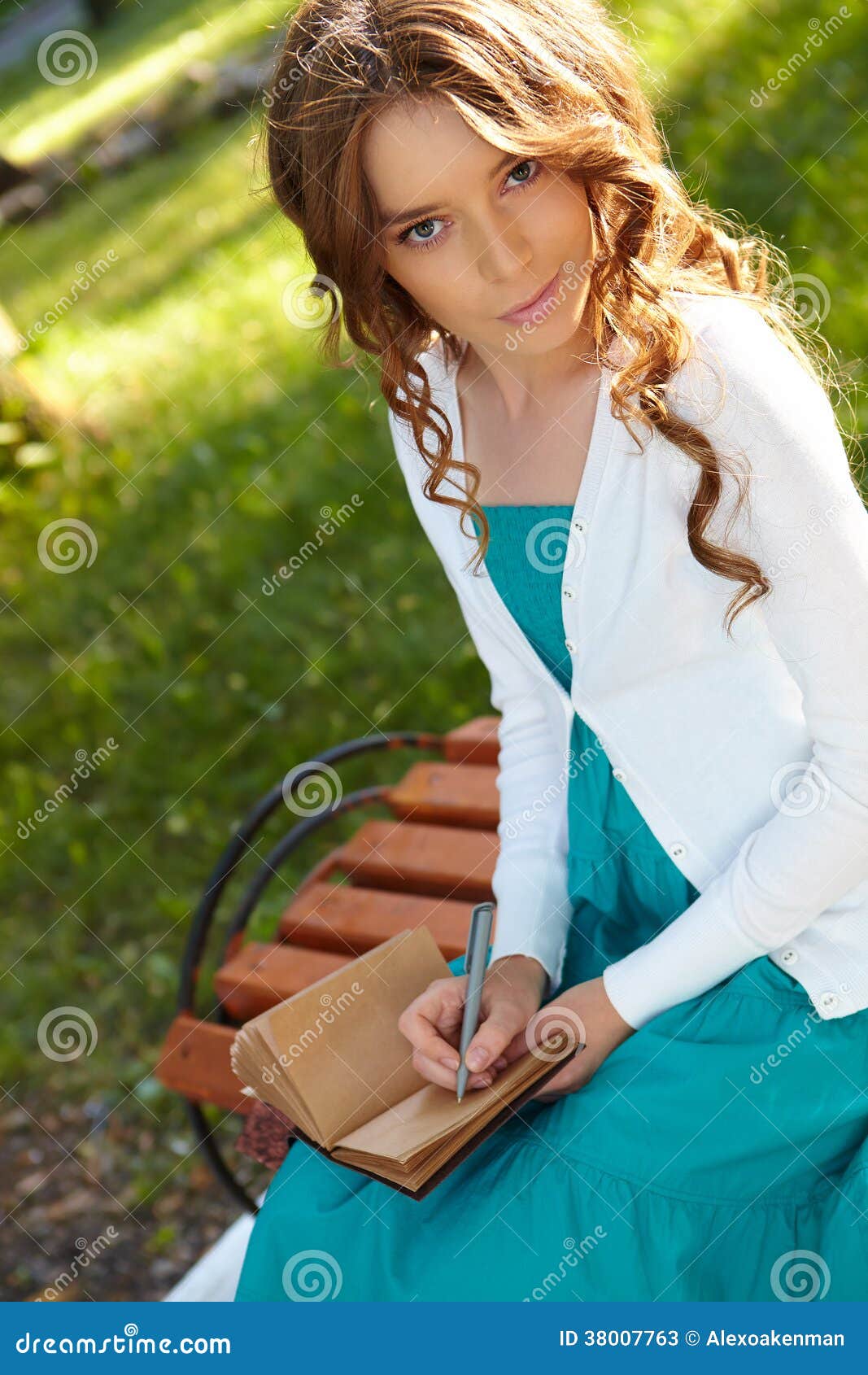 Young Woman Writes in Notebook. Stock Image - Image of camera, woman ...