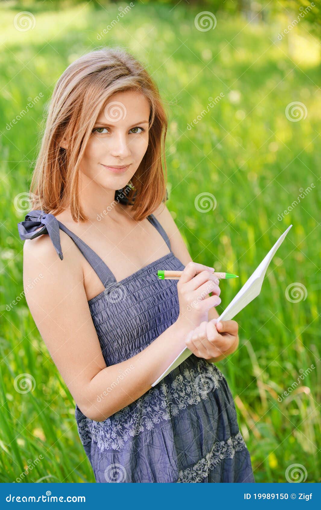 Young Woman Writes on Sheet of Paper Stock Photo - Image of hair ...