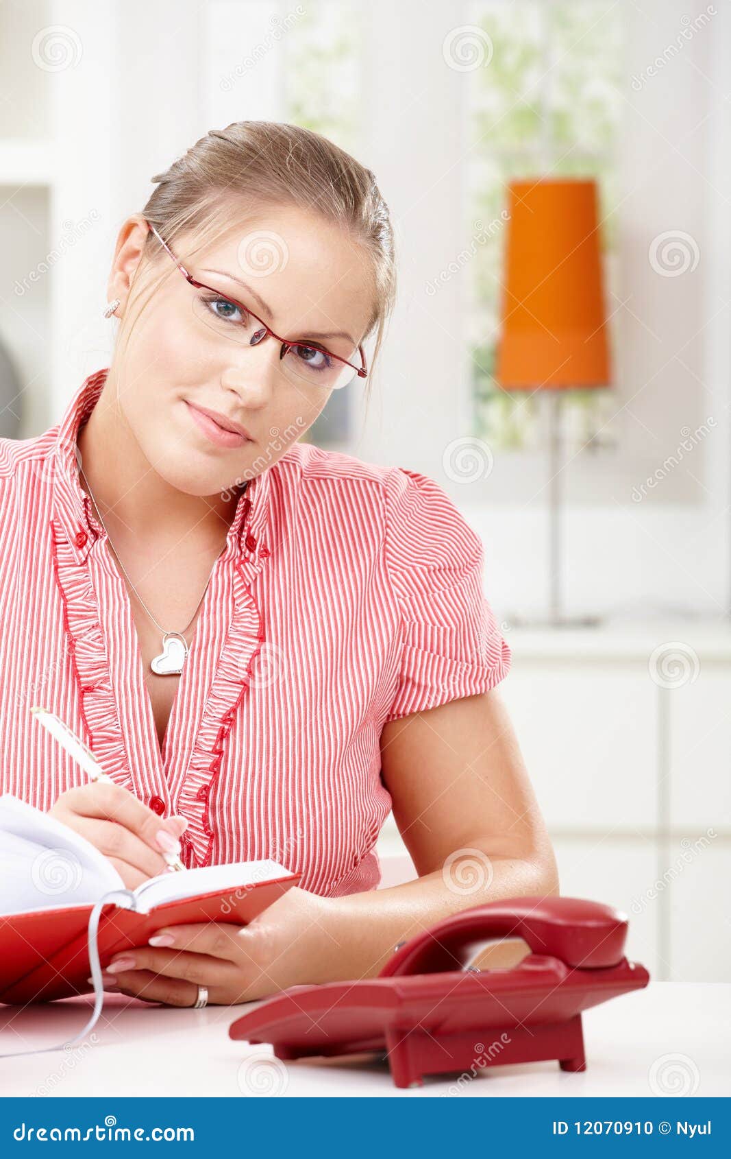 Young woman writing diary stock photo. Image of blond - 12070910