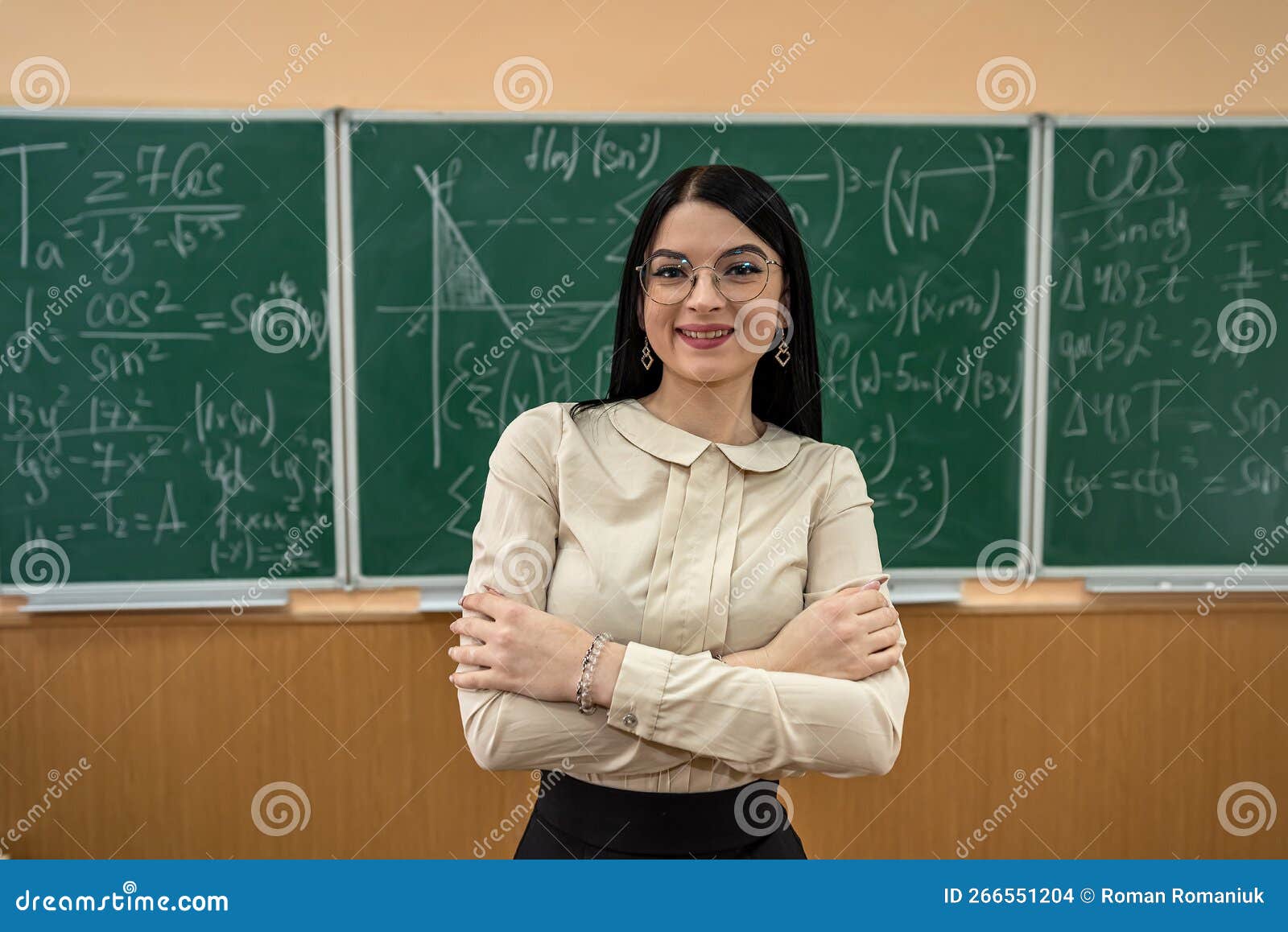 Young Woman Writing Mathematical Equations on the Blackboard in ...