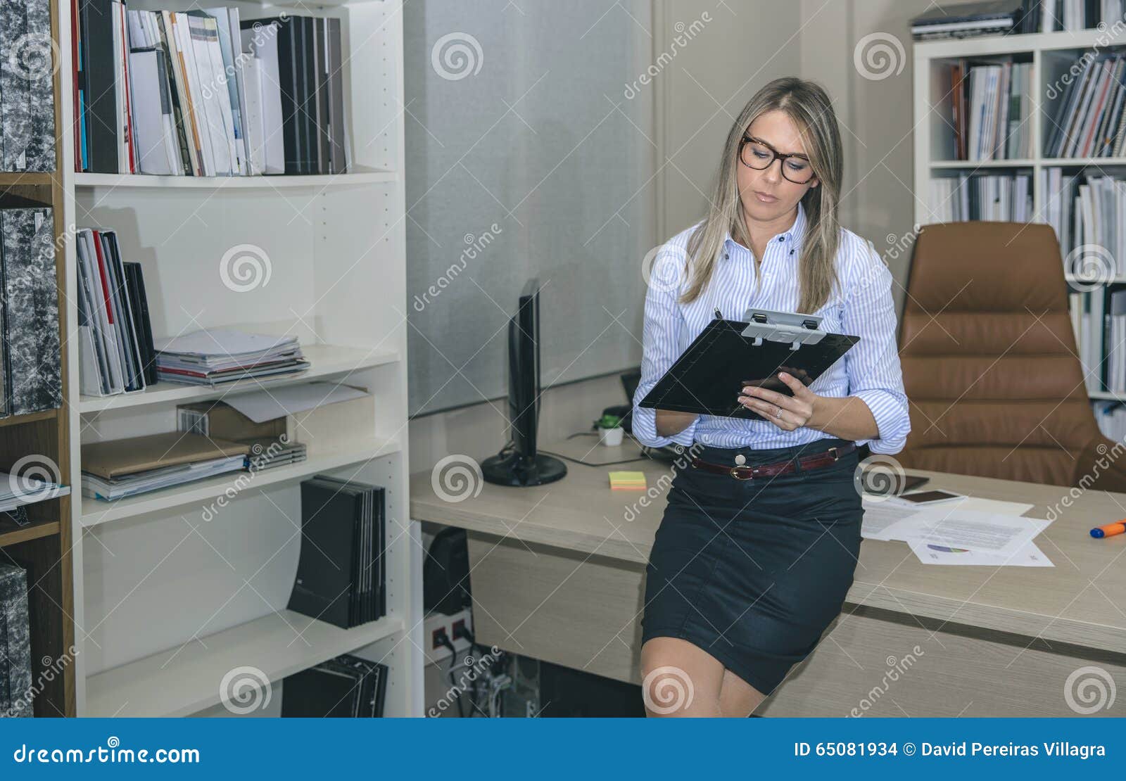 Young Woman Writing Notes at Her Workplace Stock Photo - Image of ...