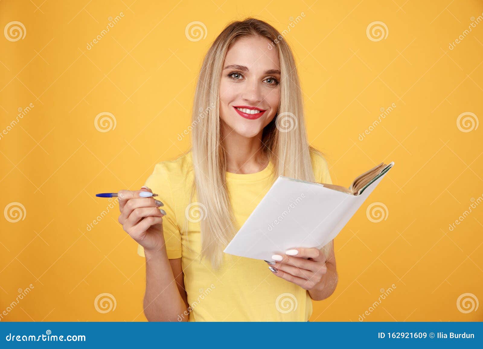 Young Woman Writing in Organizer by Pen. Stock Image - Image of holding ...