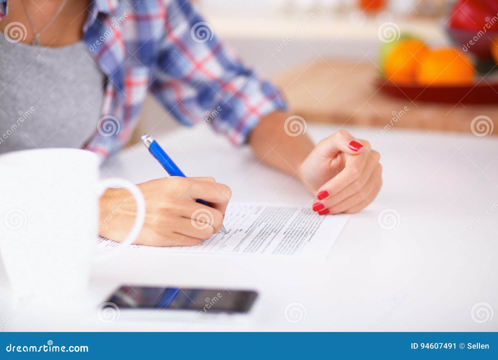 Young Woman Writing Something in Her Note Pad Stock Image - Image of ...