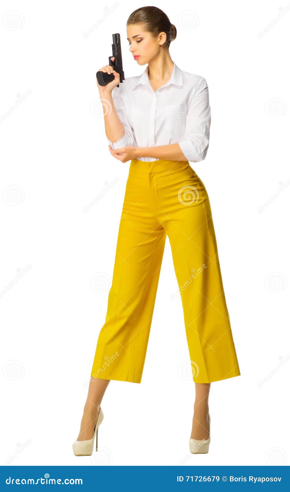 Young Woman in Yellow with Gun Stock Image - Image of isolated ...
