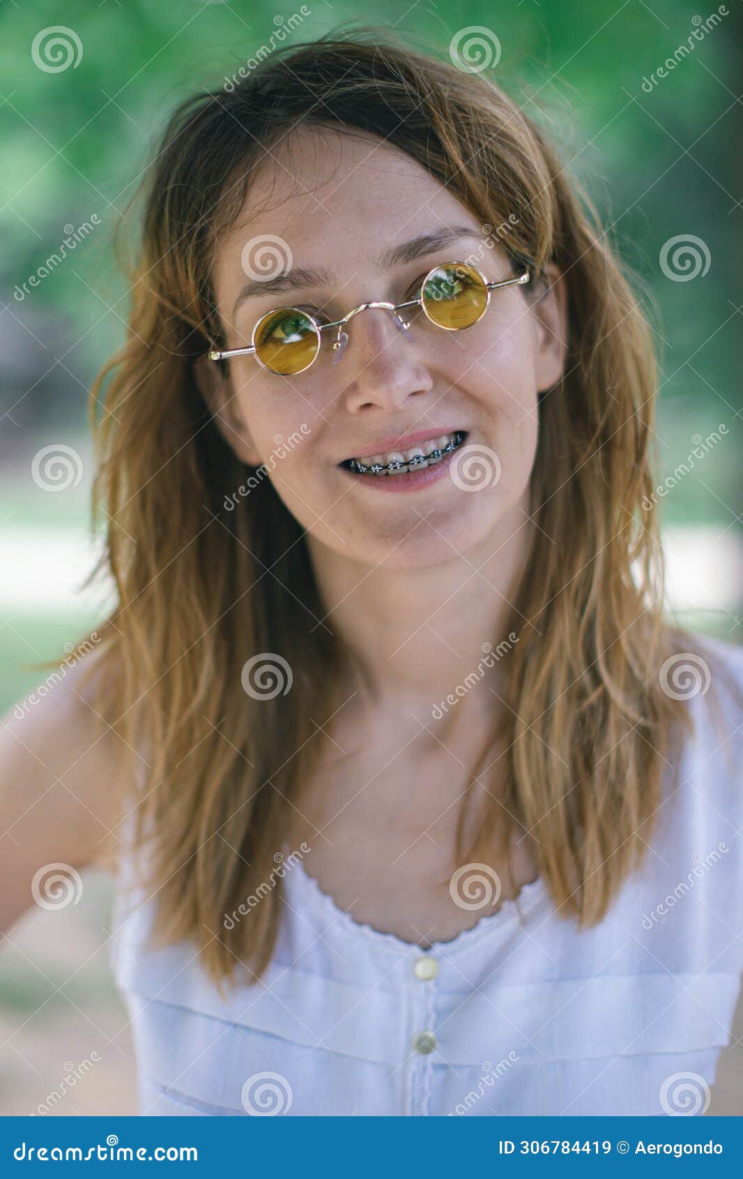 Young Woman With Yellow Round Glasses And Tooth Braces Stock Image Image Of Dental Green