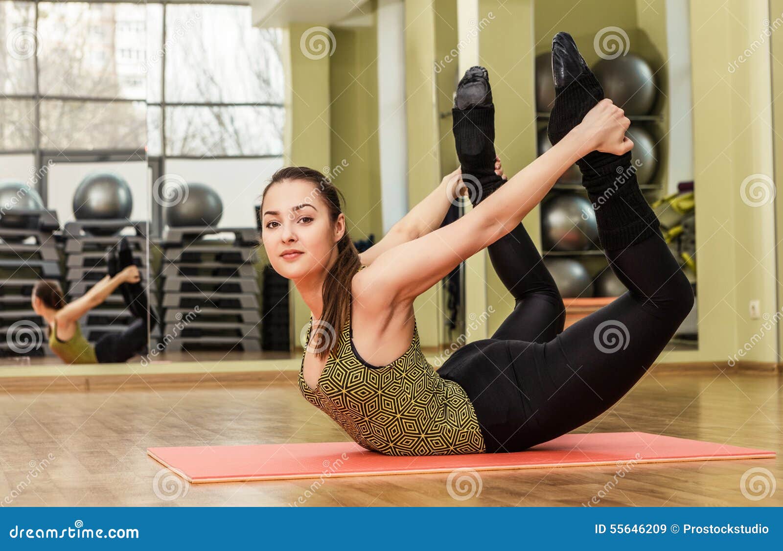 Young Woman in a Yoga Stretching Bow Pose Stock Image - Image of ...